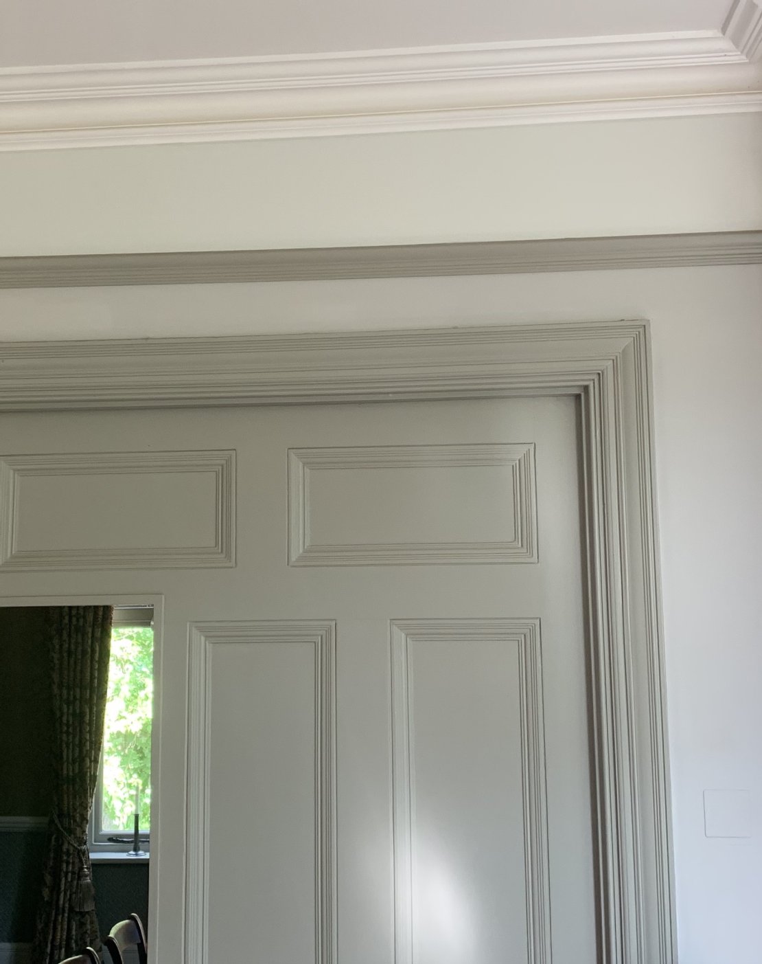 How can wooden picture rails add a decorative element to any home?