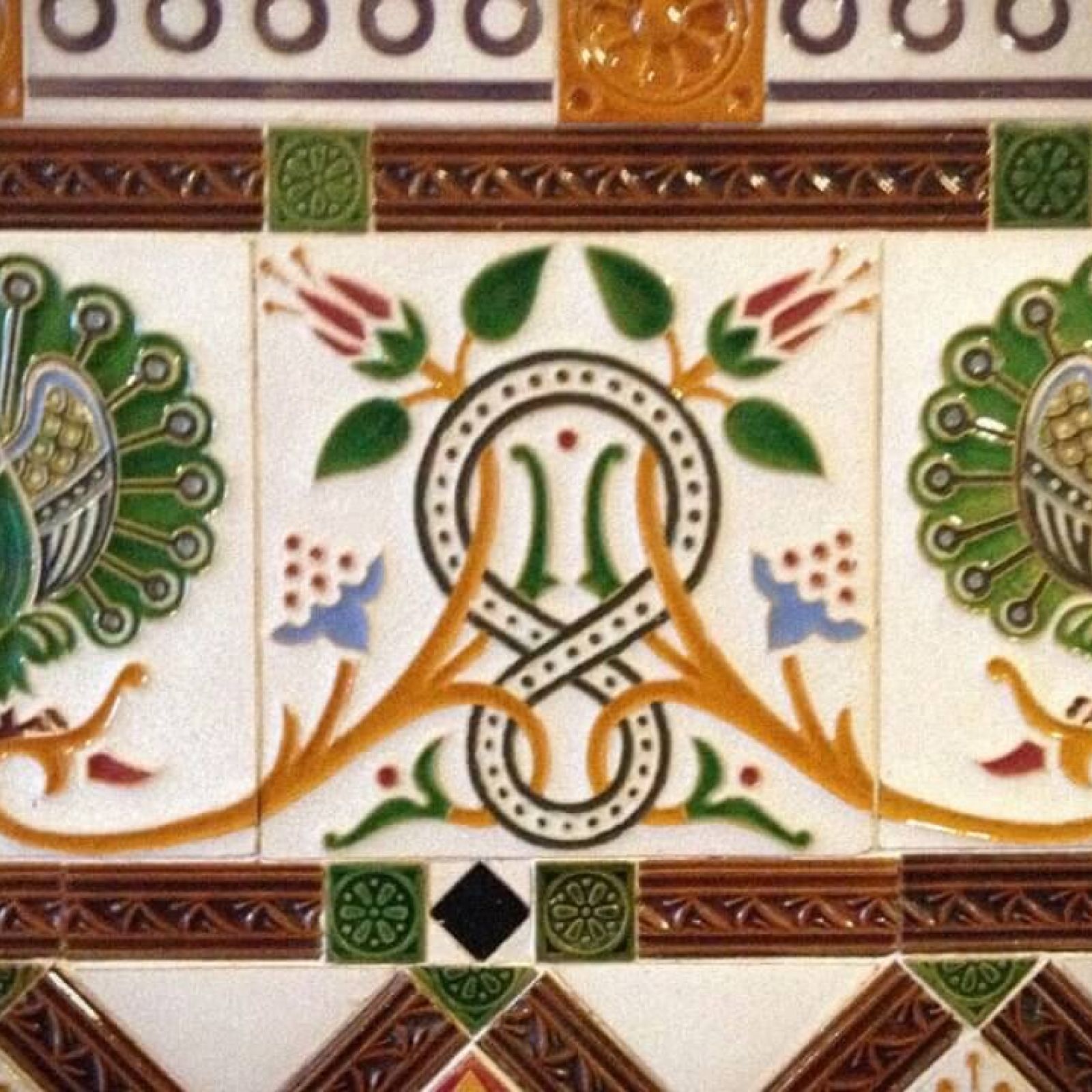 Decorative multi coloured tiles with peacock and flowers