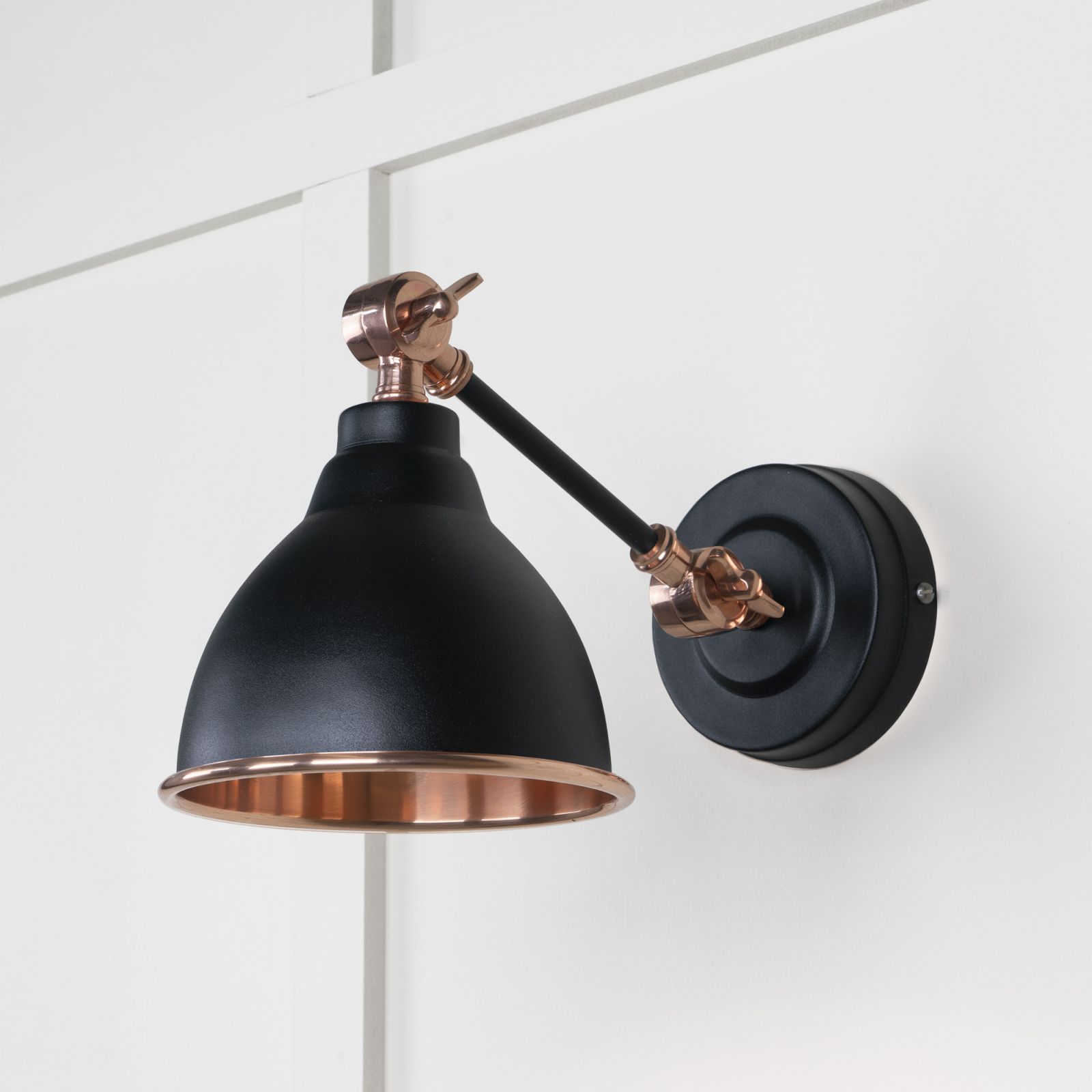 Brindle Wall Light with Smooth Copper Interior and Black Exterior